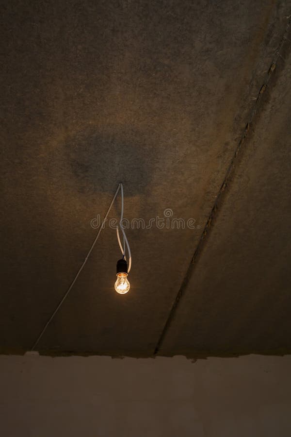 Light Bulb on the Ceiling. Lonely Light Bulb and Wire Sticking Out of ...