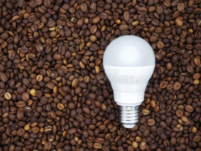 Light Bulb on Coffee Beans Texture Background.Top View Stock Photo ...