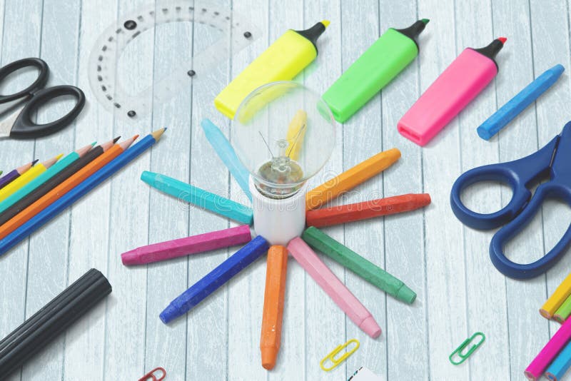 Light Bulb with Colored Crayons on the Table Stock Image - Image of ...