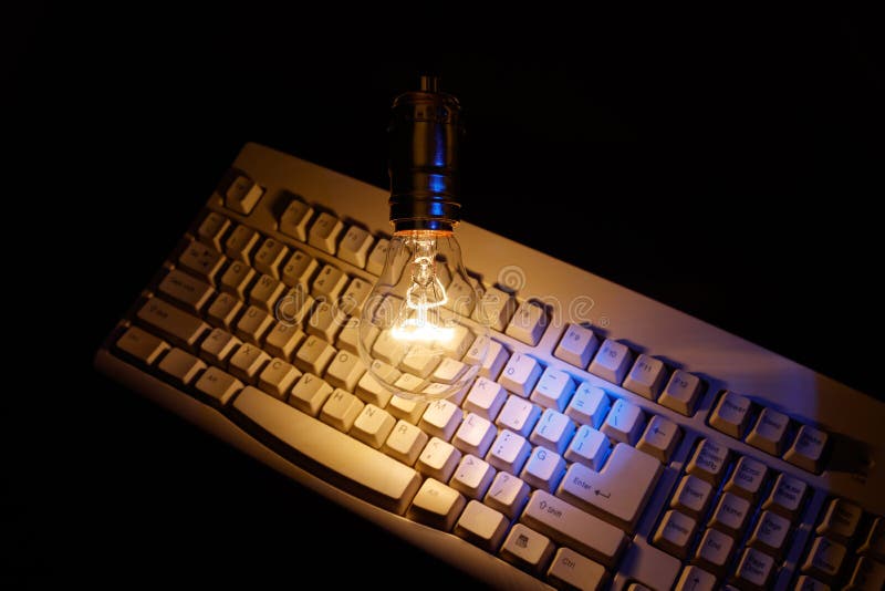 Light Bulb and Computer Keyboard Stock Photo - Image of bulb, lightbulb ...