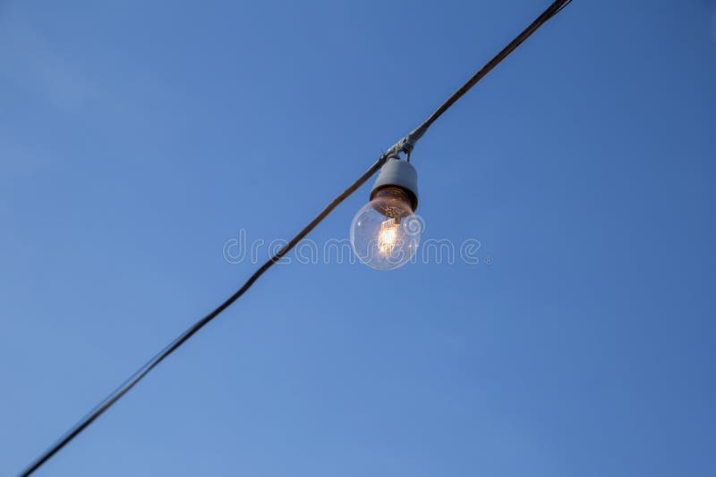 A Light Bulb Connected To an Electrical Wire. Stock Photo - Image of ...