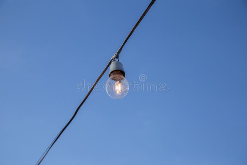 A Light Bulb Connected To an Electrical Wire. Stock Photo - Image of ...