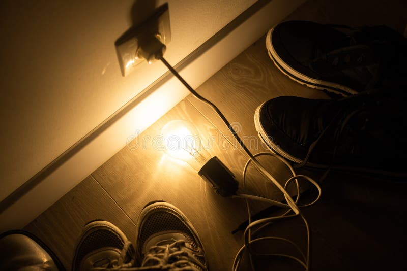 A Light Bulb with the Cord Lit. Stock Photo - Image of electric ...