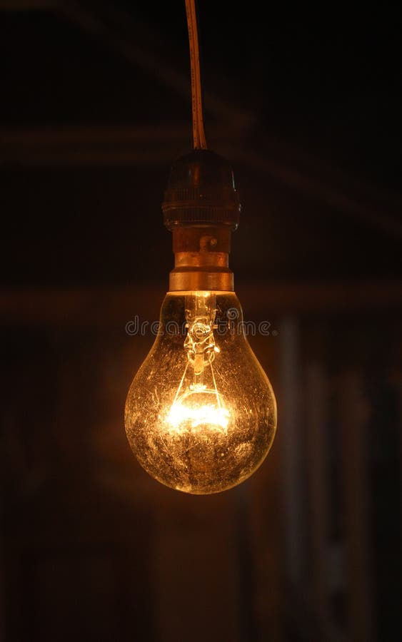 Light bulb in the dark stock image. Image of glow, hanging - 161979001