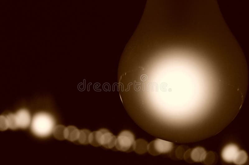 Light Bulb on in a Dark Room with Back Lights Stock Photo - Image of ...