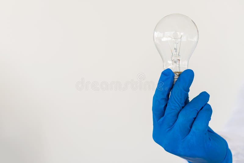 A Light Bulb in a Doctor`s Hand on a White Background Stock Image ...
