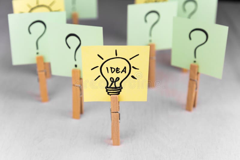 Light Bulb Doodle Drawn on Sticky Note among Many Question Marks. Hand ...