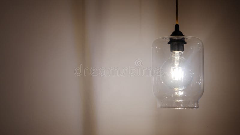 Light Bulb on Empty Beige Wall with Copy Space for Inspiration or Idea ...