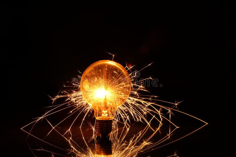 Light Bulb Exploding Emitting Sparks Stock Photo - Image of filament ...
