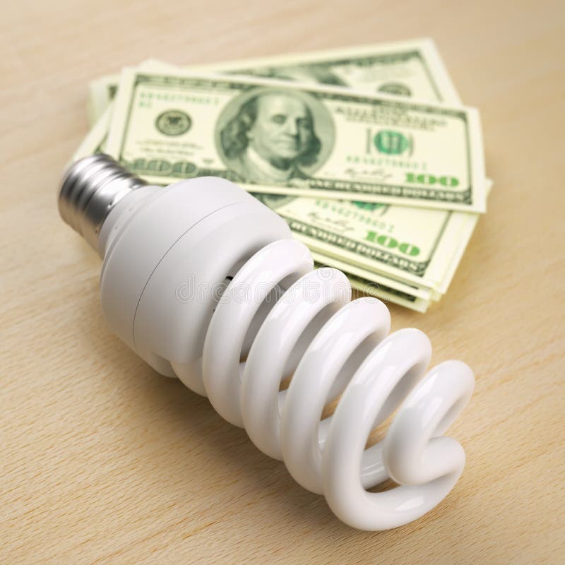 Light Bulb in Front of Dollar Bills Stock Image - Image of electric ...