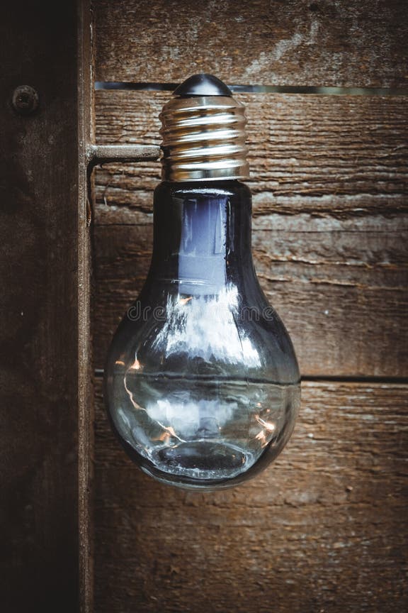 Light Bulb in Front of a Wooden Wall Stock Photo - Image of retro ...