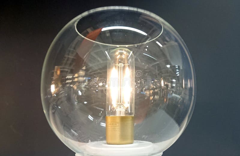 Light bulb in glass bowl stock photo. Image of artwork - 254489300