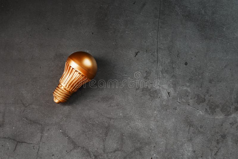 Light Bulb from Gold on Black Stone Concept of a Profitable Idea. Stock ...