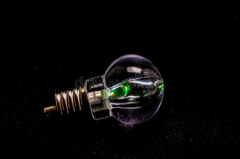A Light Bulb with a Green Bulb Inside Stock Image - Image of green ...