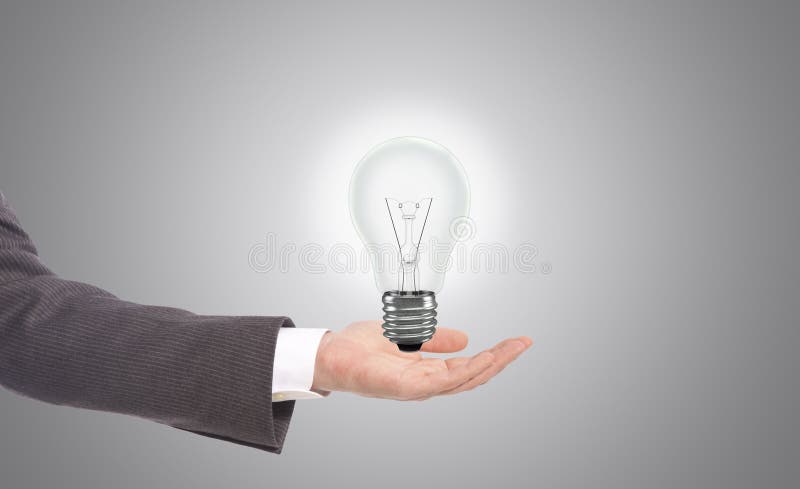 Light bulb in a hand stock photo. Image of think, efficiency - 29506228