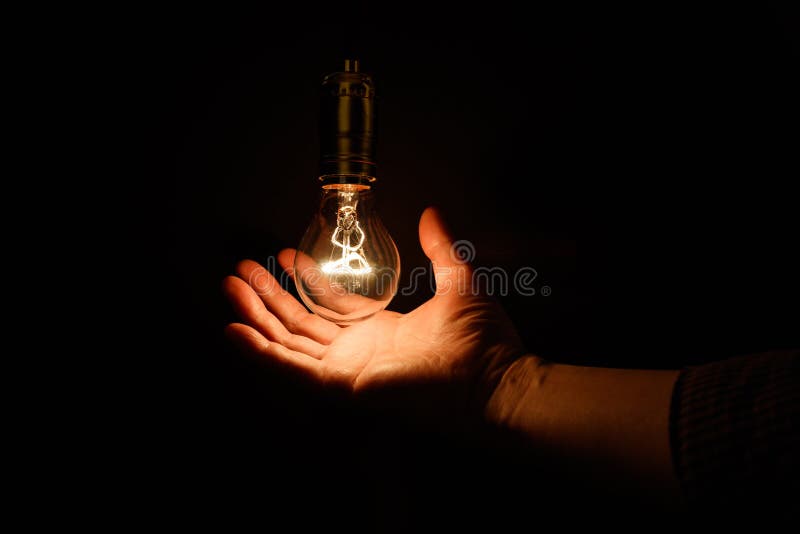 Light bulb and hand stock image. Image of lighting, glowing - 86109769