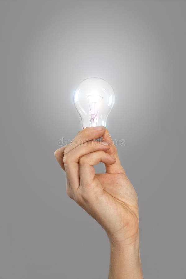 Light bulb in hand stock image. Image of economic, fingers - 36729845
