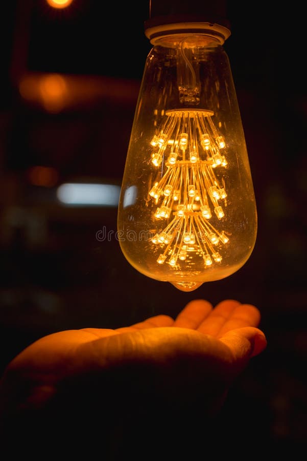 Light bulb with hand stock image. Image of creative - 103484833