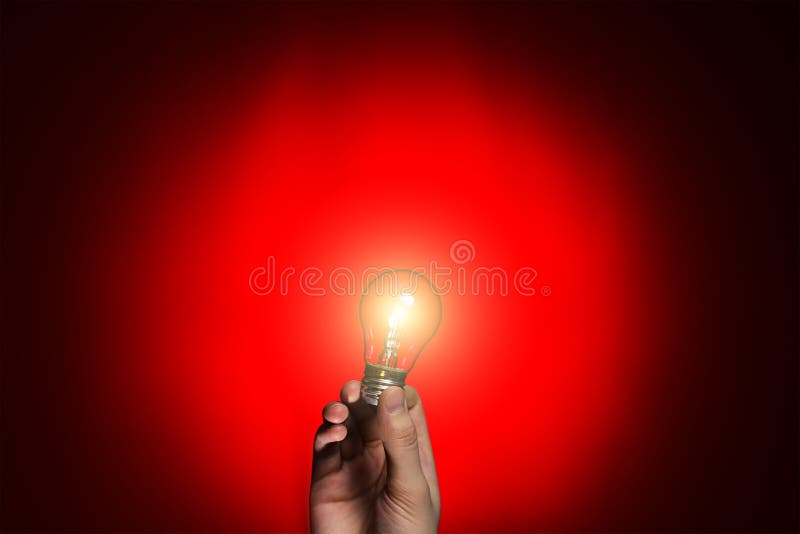 Light Bulb In Hand On Red Background Stock Photo - Image of electric ...