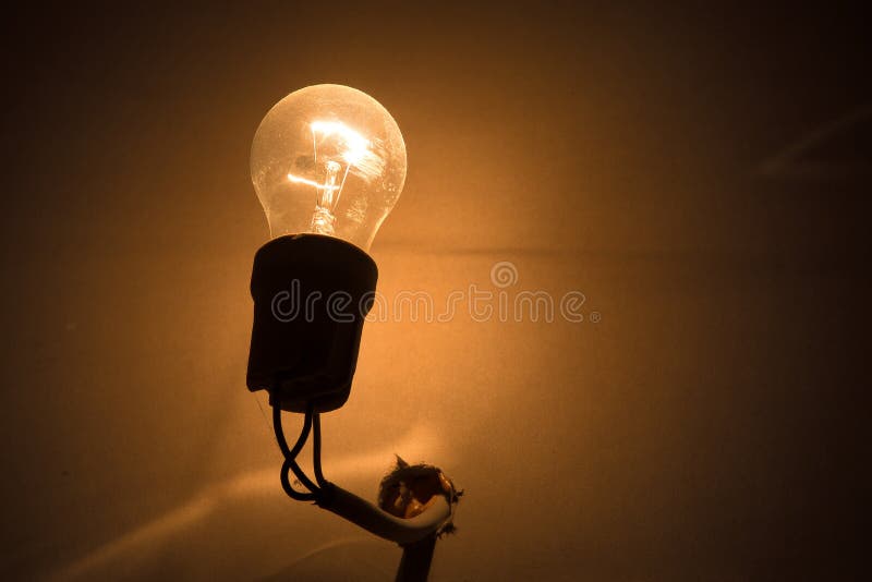 Light Bulb Hanging on Wire from the Hole on the Wall Stock Photo ...