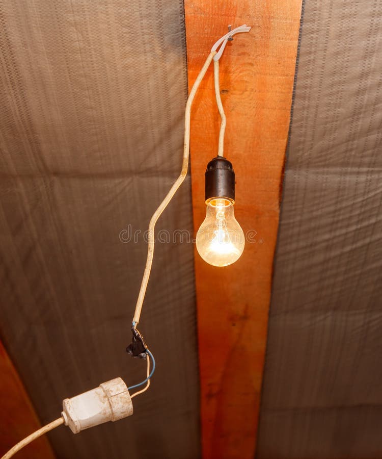 A Light Bulb is Hanging from a Wire Stock Image - Image of interior ...