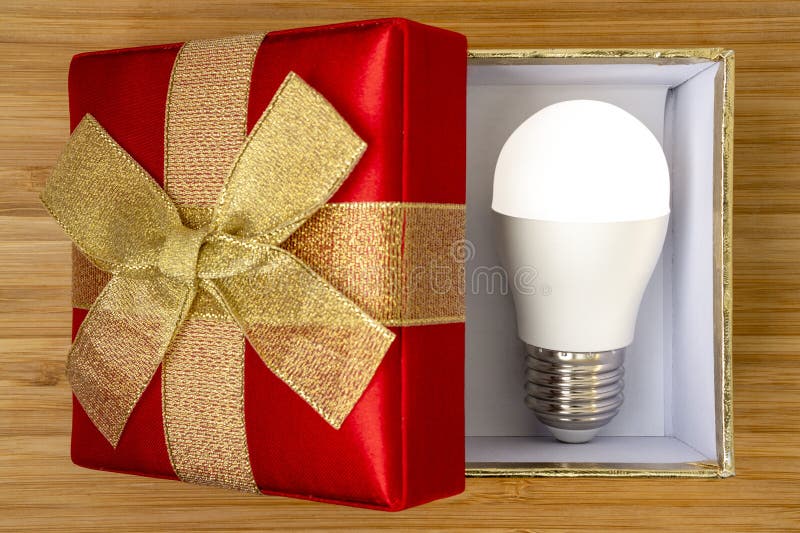 Light bulb inside gift box stock photo. Image of voltage - 275047208