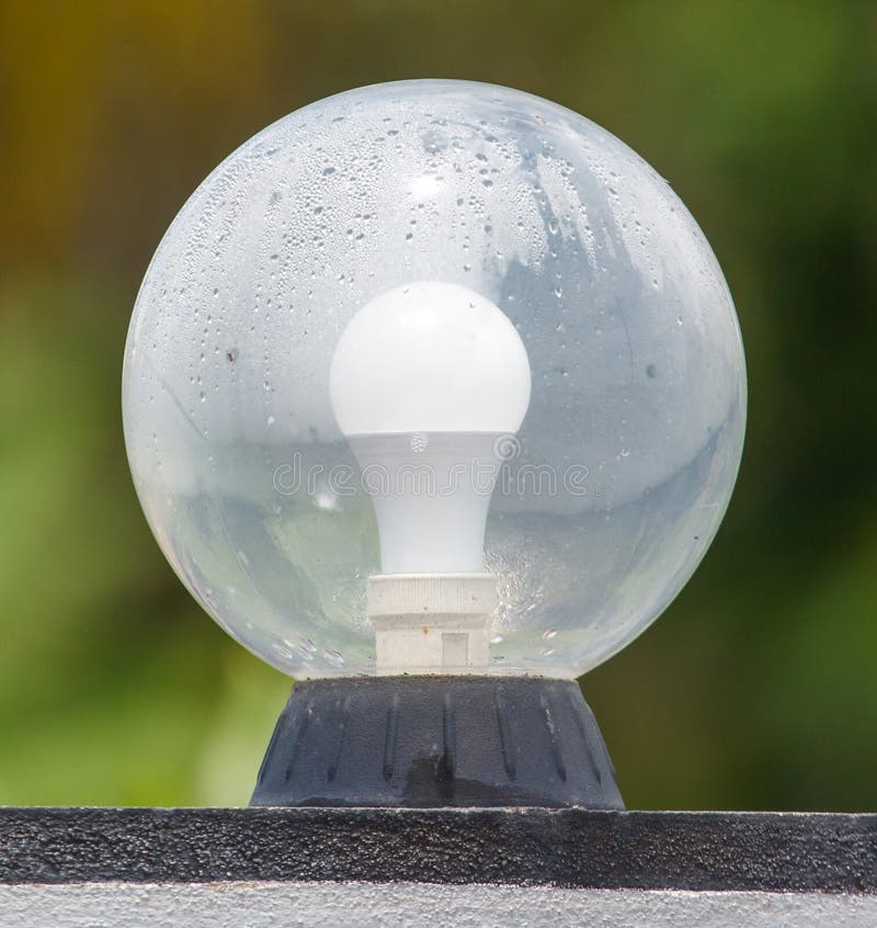 A Light Bulb is Inside a Glass Globe Stock Image - Image of technology ...