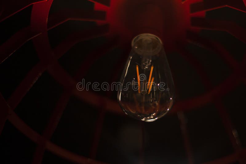 Light Bulb in the Interior. Light Bulb in a Dark Room Stock Image ...