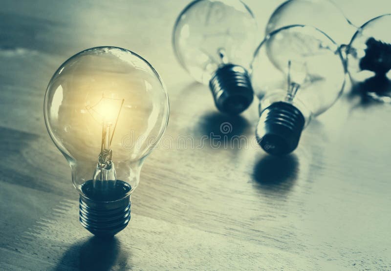 Light bulb isolate on wood stock photo. Image of fluorescent - 95803336