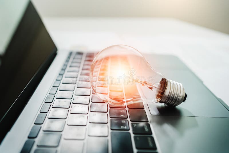 Light Bulb on Laptop Computer. Power Energy Concept Stock Photo - Image ...