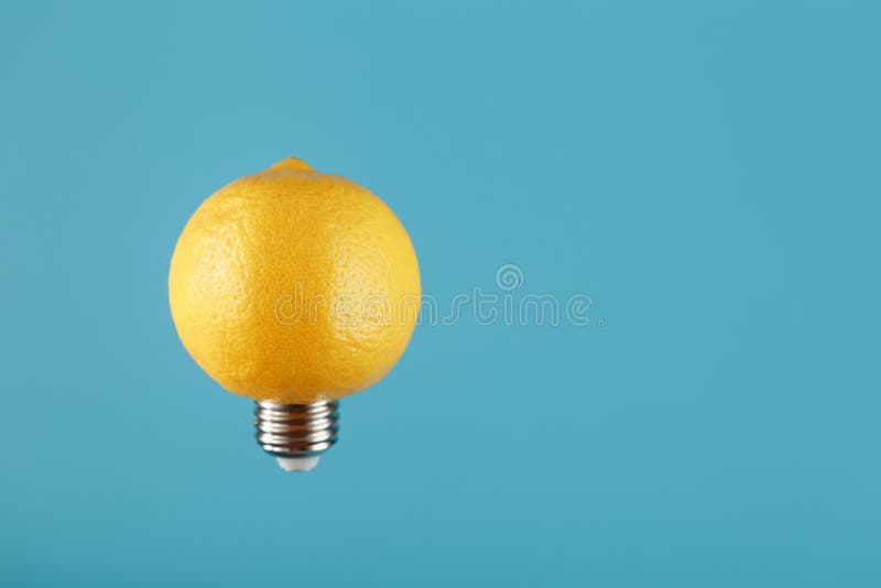 Light Bulb Lemon in Flight on a Blue Background. the Conceptual Idea ...