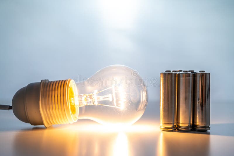 Light Bulb Lit and Batteries Next To it. Stock Image - Image of dioxide ...