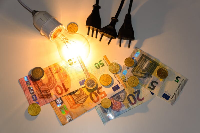 Light Bulb on, with Electrical Plugs, Banknotes and Coins. Energy ...