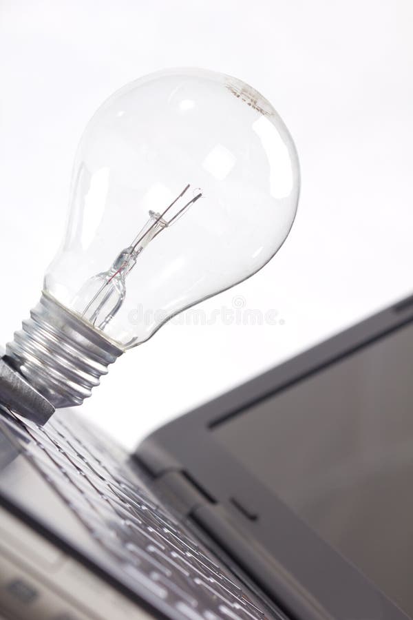Light bulb on a notebook. stock image. Image of keypad - 25244089