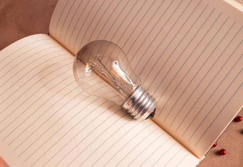 Light Bulb on Notepad, Idea, Creativity Stock Image - Image of pink ...