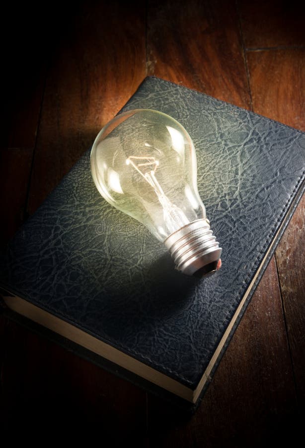 Light bulb on old book. stock image. Image of creativity - 69941227