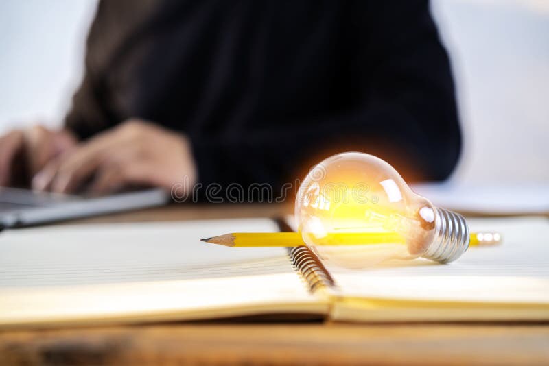 A Light Bulb is Placed on Book for Reading, Acquiring Knowledge and ...