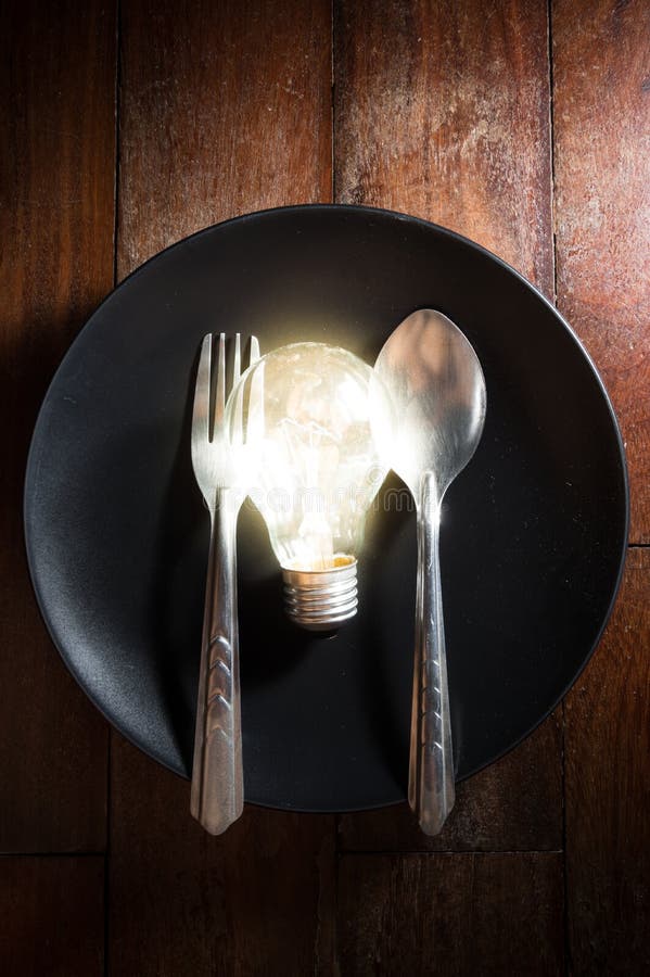 Light Bulb on Plate with Soon and Fork Stock Photo - Image of ...