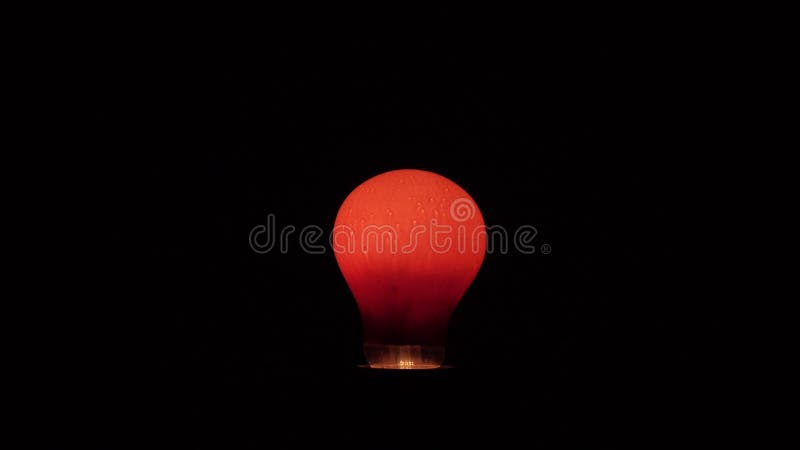 The Light Bulb is Red in the Dark. Stock Footage - Video of flashing ...
