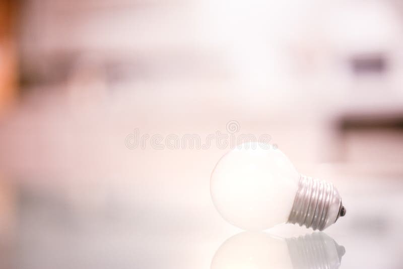 Light Bulb and Reflection on Glass Table with Space for Thinking Ideas ...