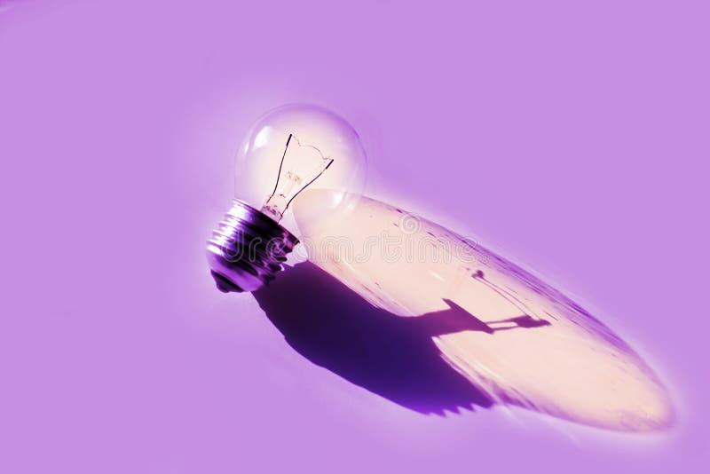 Light Bulb with Reflection on Purple Background Stock Photo - Image of ...
