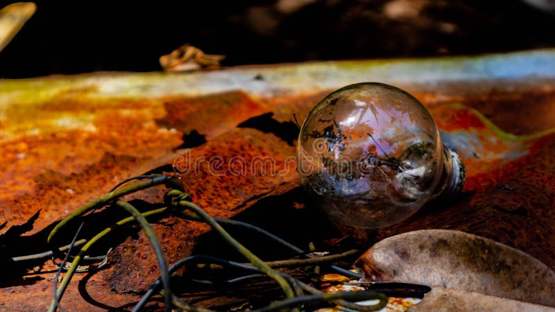 Light Bulb on Rusty Zinc As a Background Stock Photo - Image of glowing ...
