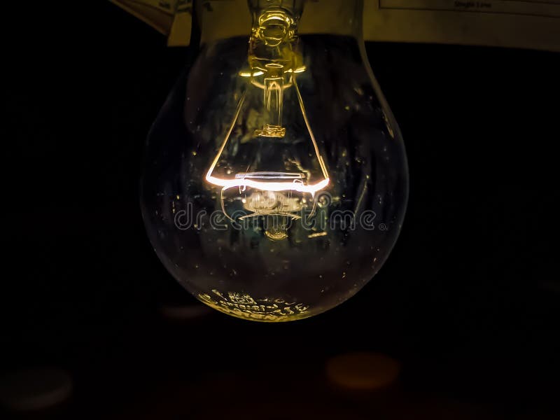 Light Bulb in the shadows stock image. Image of iron - 184318861