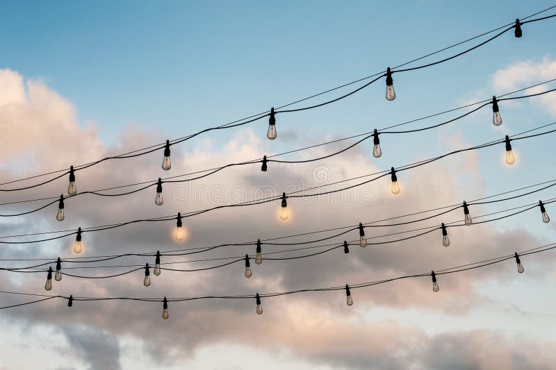 Light Bulb Shine Hanging on Electric Line with Blue Sky Stock Image ...