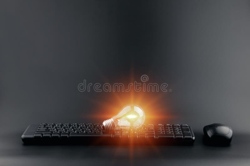Light Bulb Shining on Keyboard Stock Photo - Image of creativity, bulb ...