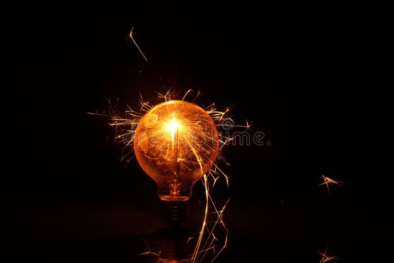 Light Bulb Exploding Emitting Sparks Stock Photo - Image of design ...