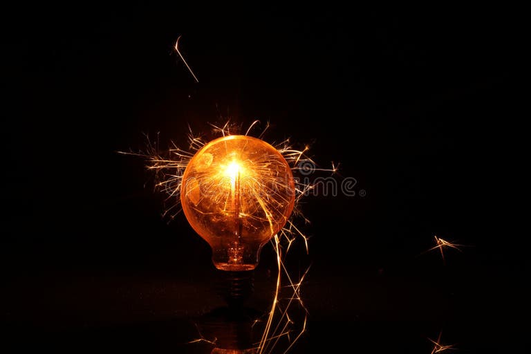 Light Bulb Exploding Emitting Sparks Stock Photo - Image of design ...