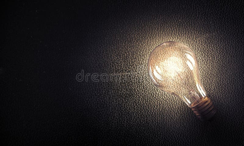 Light Bulb on Stone Surface Stock Photo - Image of decorative, filament ...