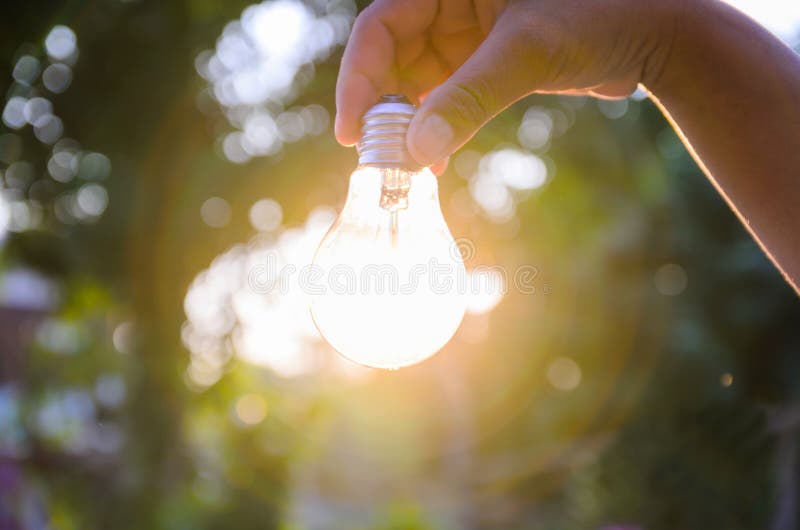 Light Bulb from Sunset on Hand Concept Stock Image - Image of earth ...