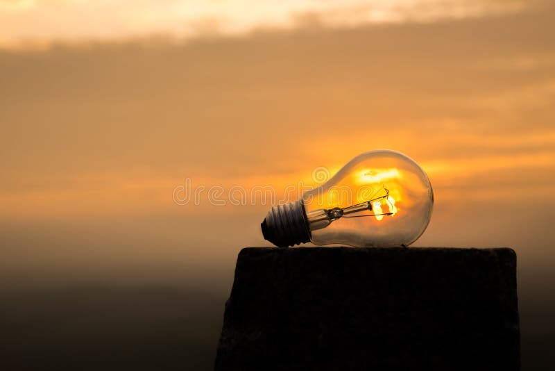 Light bulb during sunset. stock image. Image of earth - 126235787